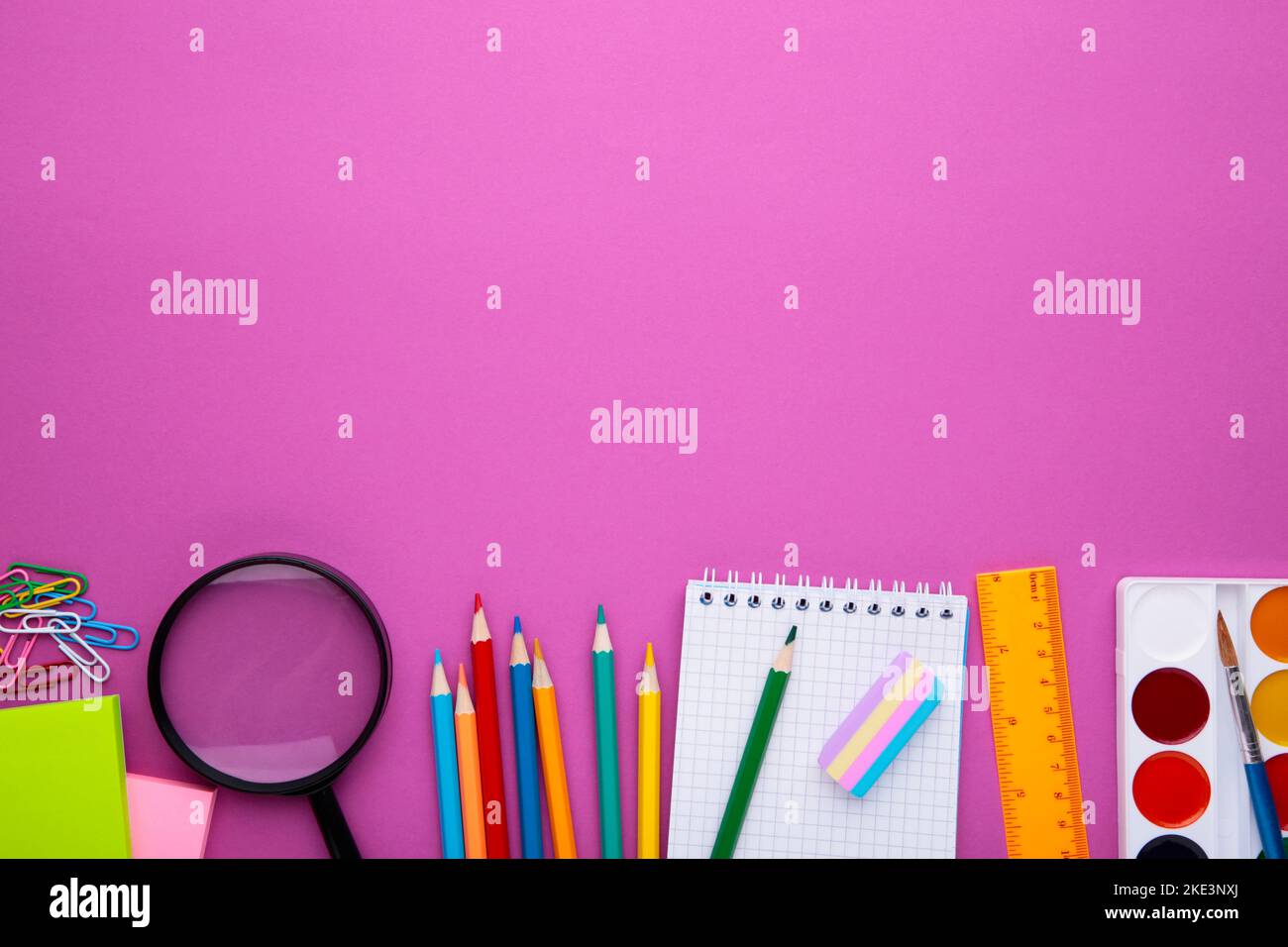 Back To School concept. School supplies on pink background with copy ...