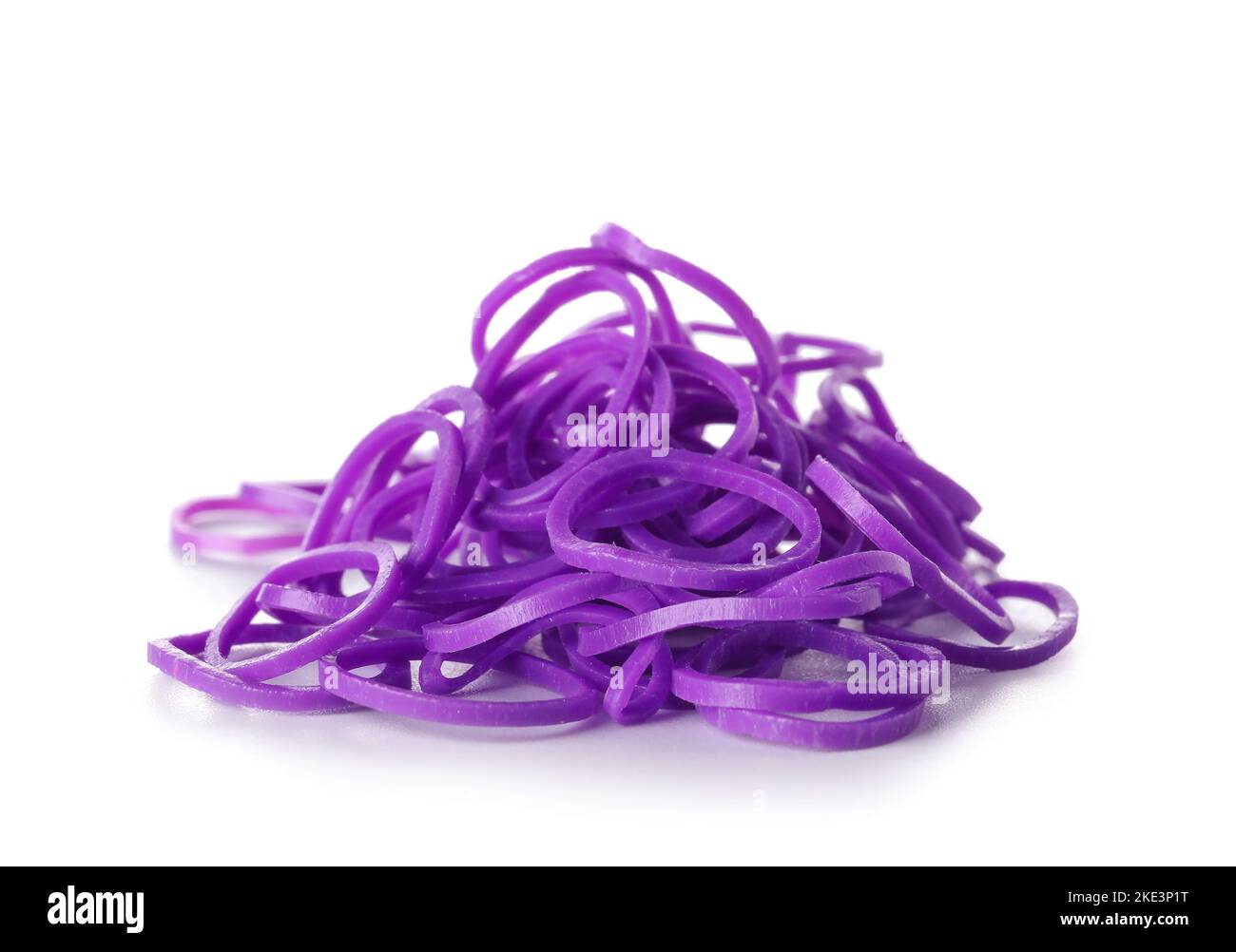 Heap of purple rubber bands on white background Stock Photo - Alamy