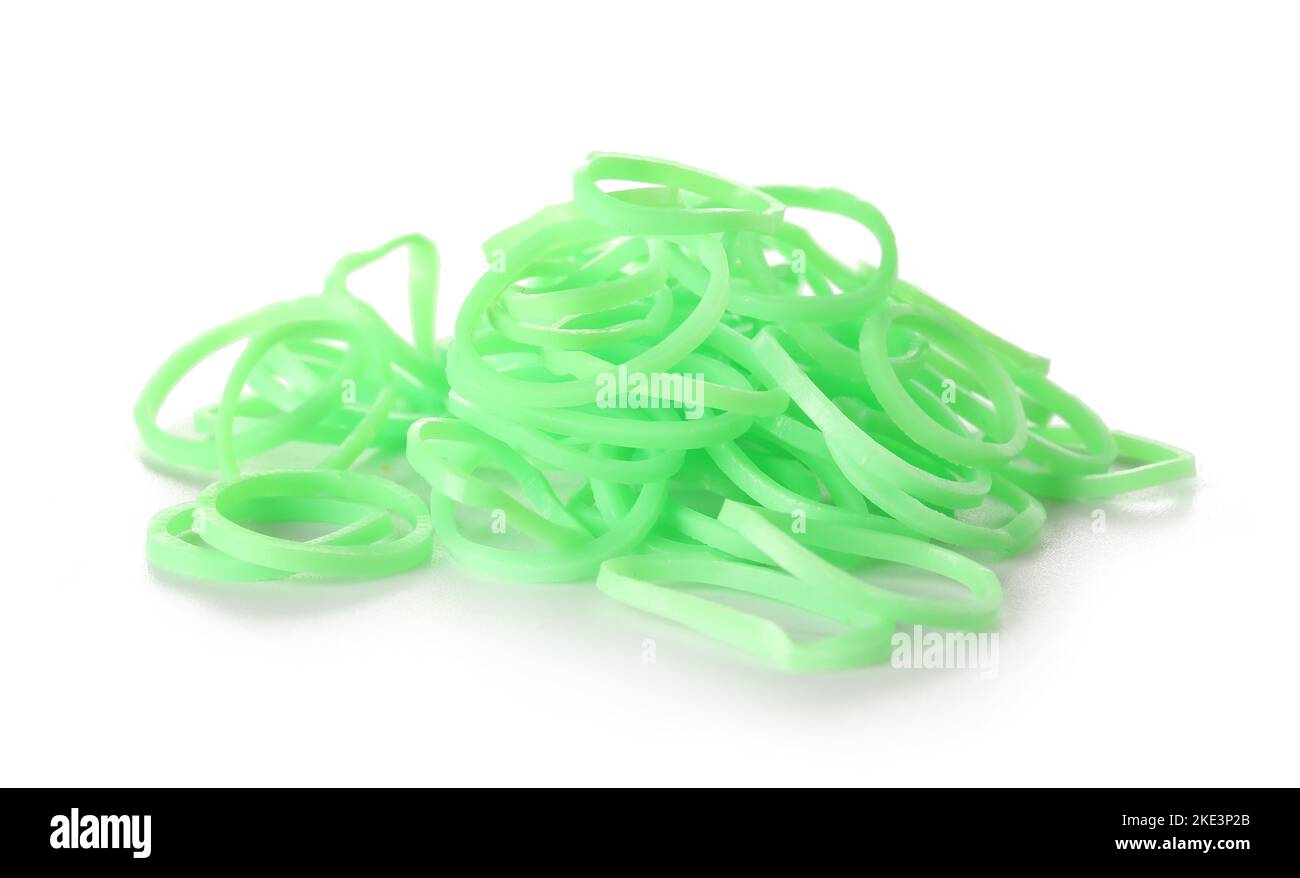 Heap of green office rubber bands on white background Stock Photo - Alamy