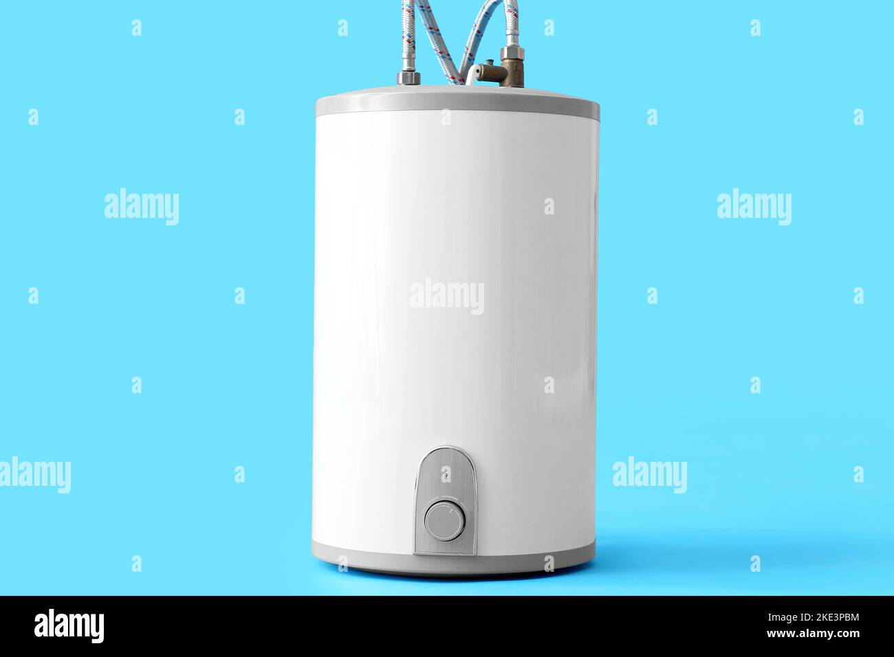 Modern electric boiler on blue background Stock Photo - Alamy
