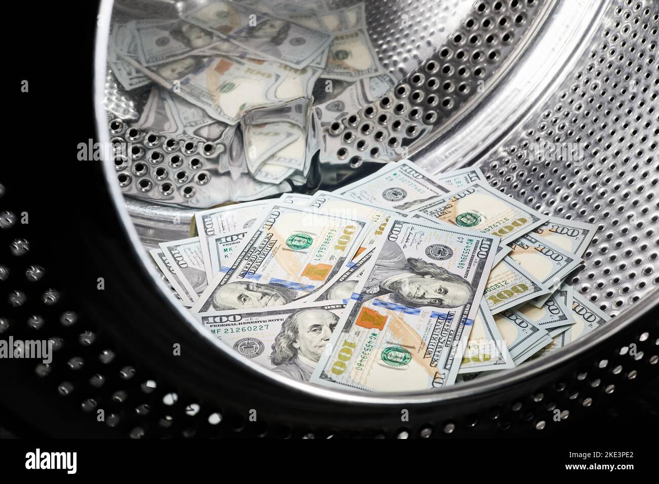 Close-up of washing dollars in machine, money laundering, financial ...
