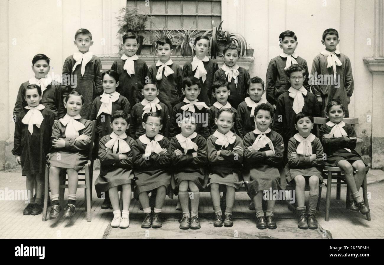School photo of the elementary pupils with the apron, Italy 1960s Stock ...