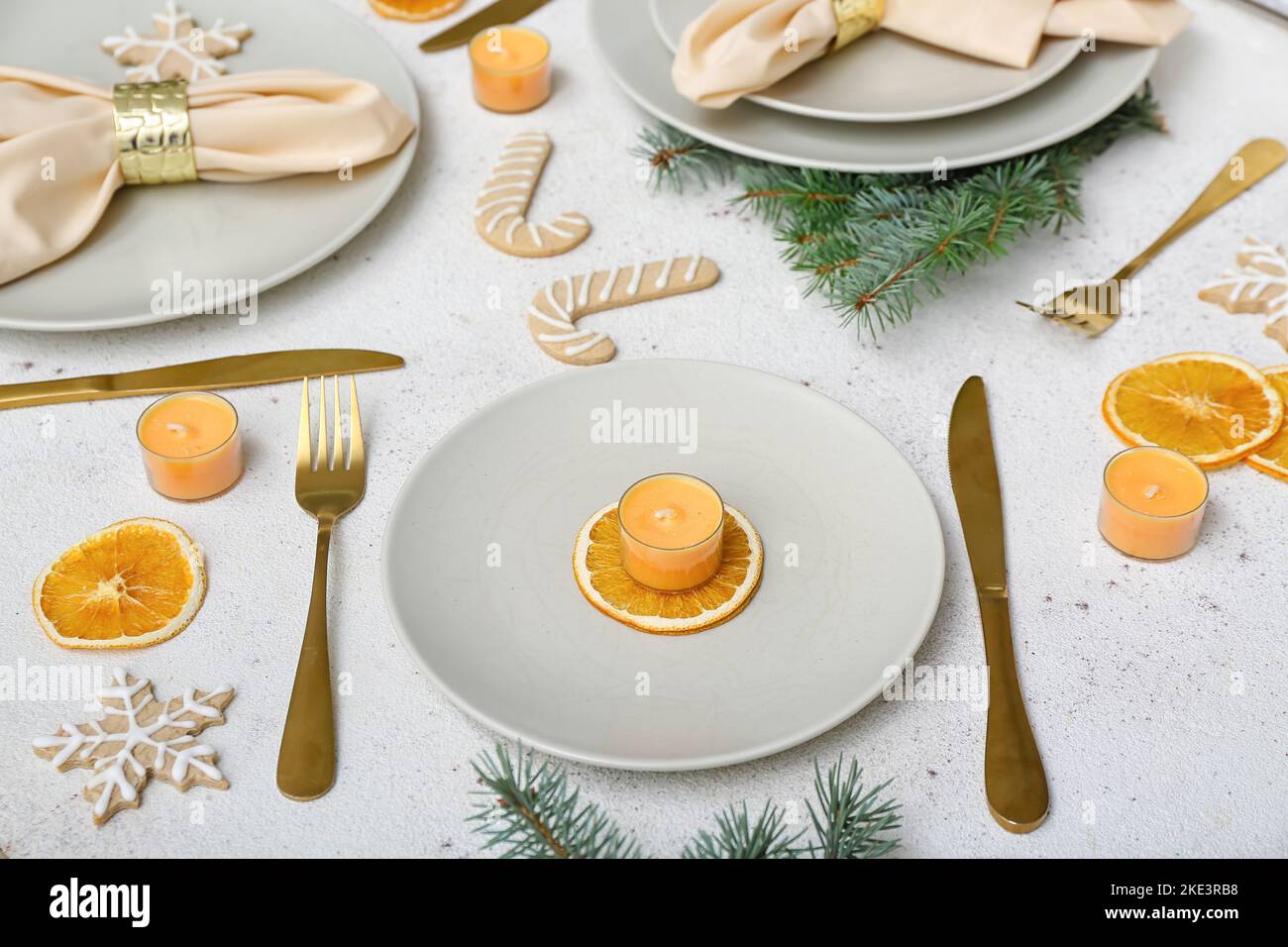 Beautiful table setting with Christmas branches, cookies and dried ...