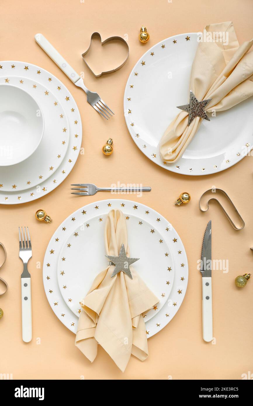 Beautiful table setting with Christmas balls and cookie cutters on ...
