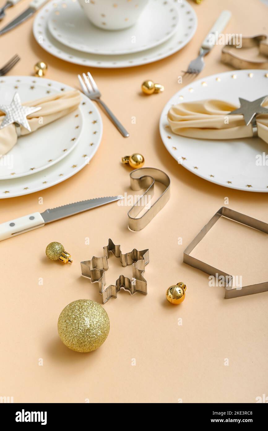 Beautiful table setting with Christmas balls and cookie cutters on ...