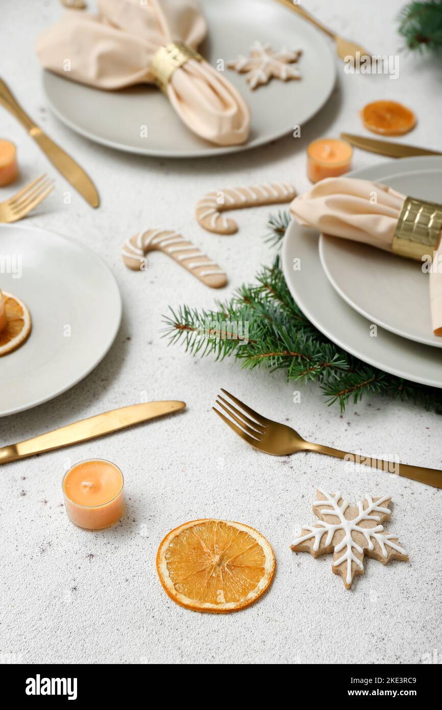 Beautiful table setting with Christmas branches, cookies and dried ...