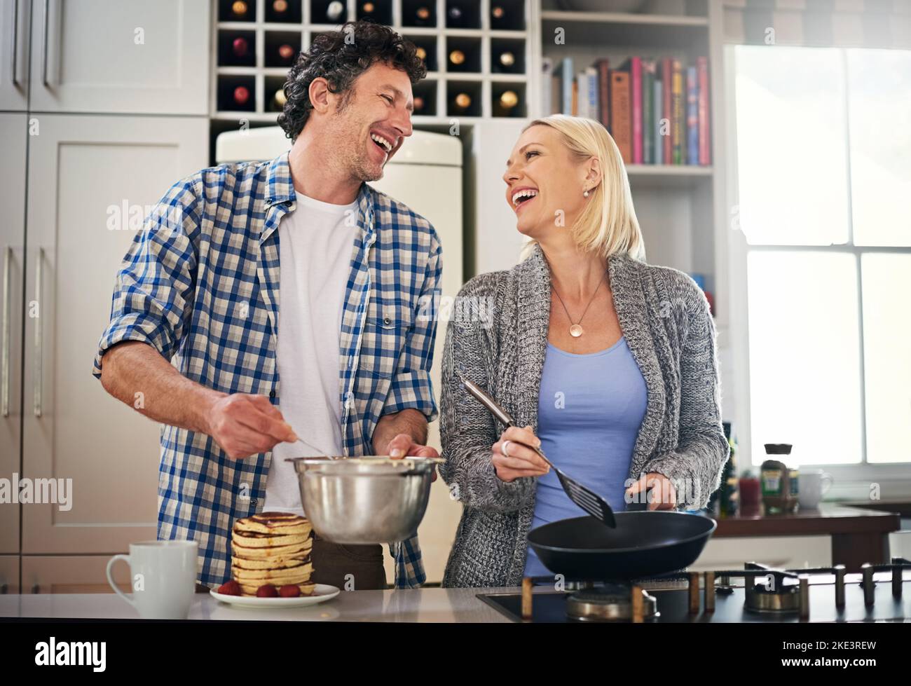 Theres always time for breakfast in this house. a happy couple making ...