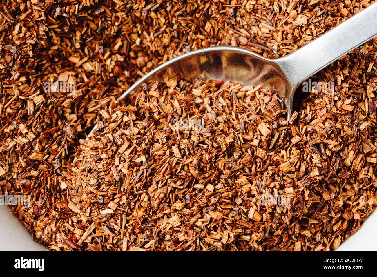 Dry leaves of red rooibos tea with a spoon close-up Stock Photo - Alamy