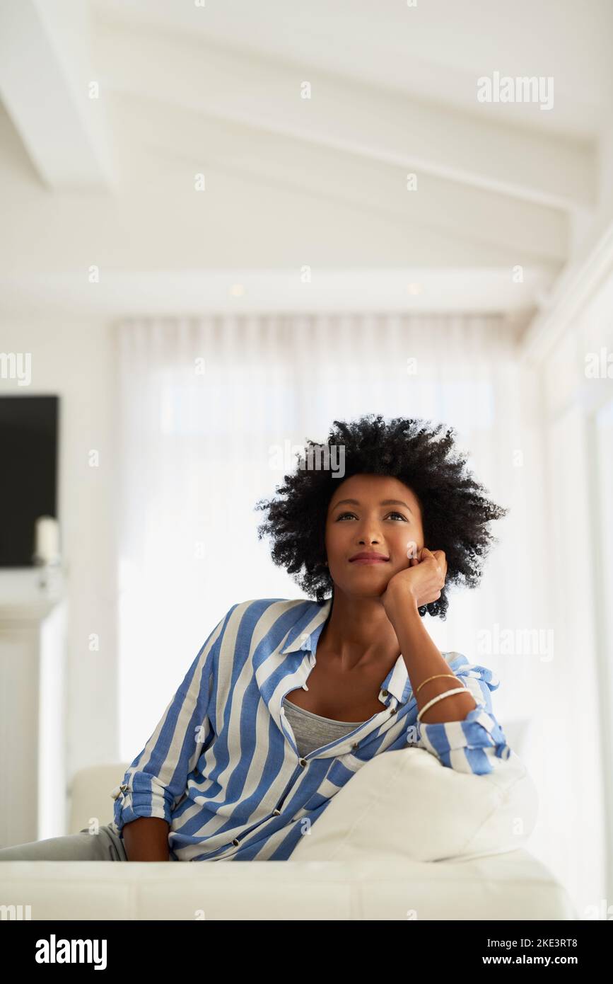 Happy to do nothing today. a young woman relaxing at home Stock Photo ...
