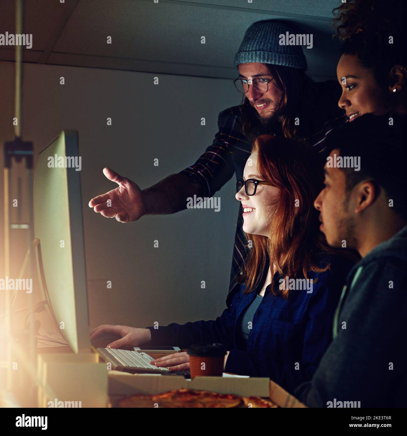 Theres our solution...a business team looking at a computer screen ...