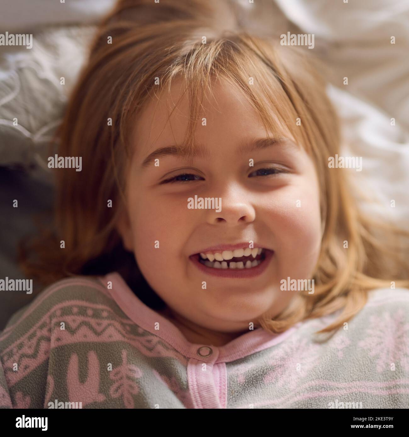 Let there be laughter. Portrait of a cute little girl giggling while ...