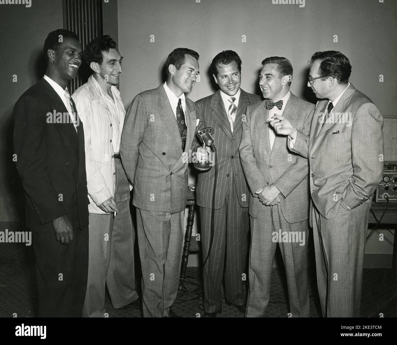 Group of men during a radio program at KFMV Union Broadcasting ...