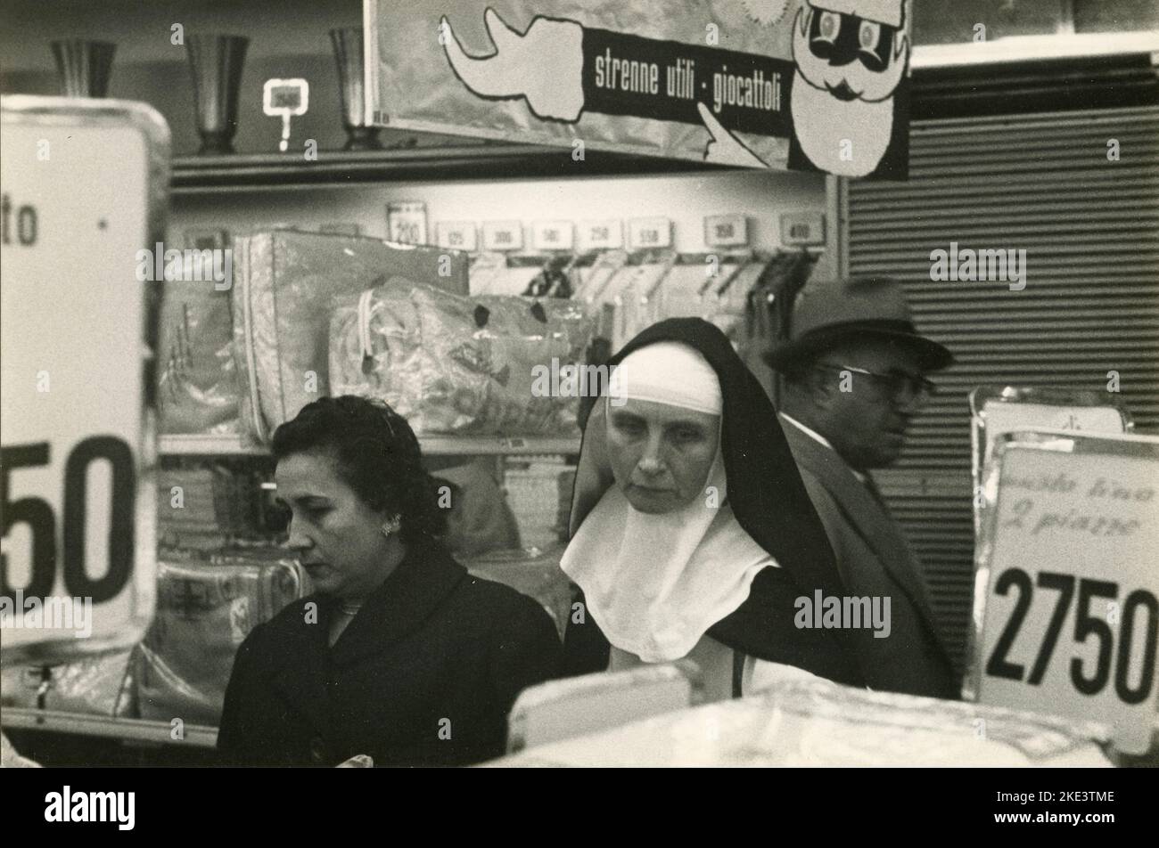 A nun shopping in a department stores, Rome, Italy 1960s Stock Photo ...