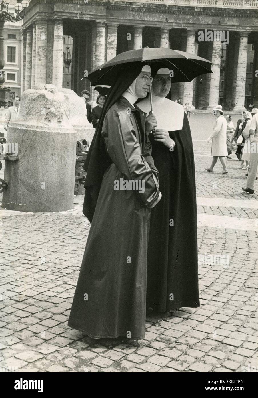 Two nuns with an umbrella in St. Peter's Square, Rome, Italy 1960s ...