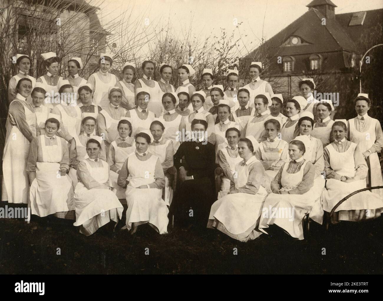 Large group of women housekeeper in uniform outside, 1920s Stock Photo ...