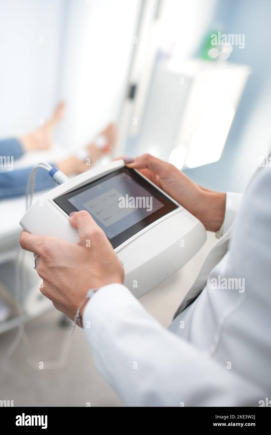 Nutritionist holds plicometric measuring machine Stock Photo - Alamy