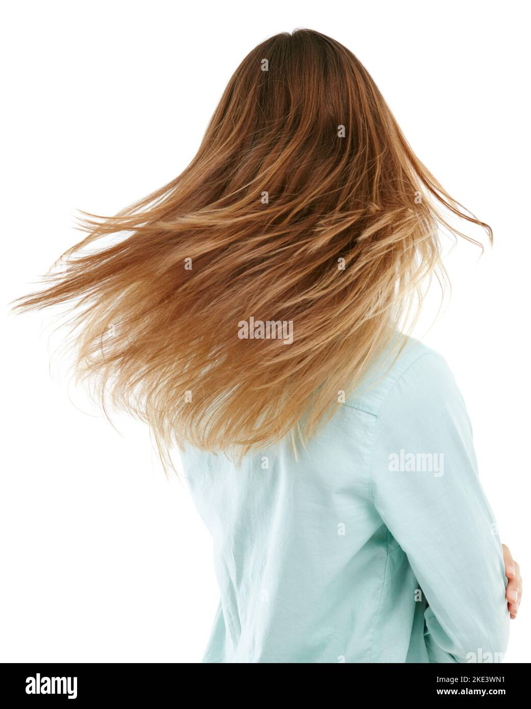 Talk to the hair. an unidentifiable woman flipping her hair against a ...