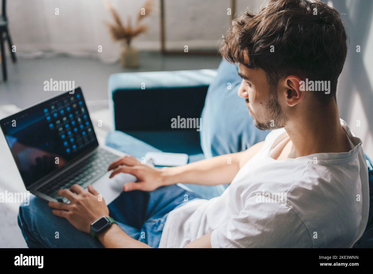 Side view of a man in white T-shirt with collagen patches under the ...