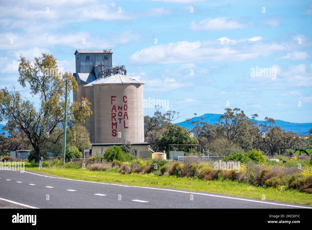 A Farms not Coal protest sign is painted in large letters on the side ...