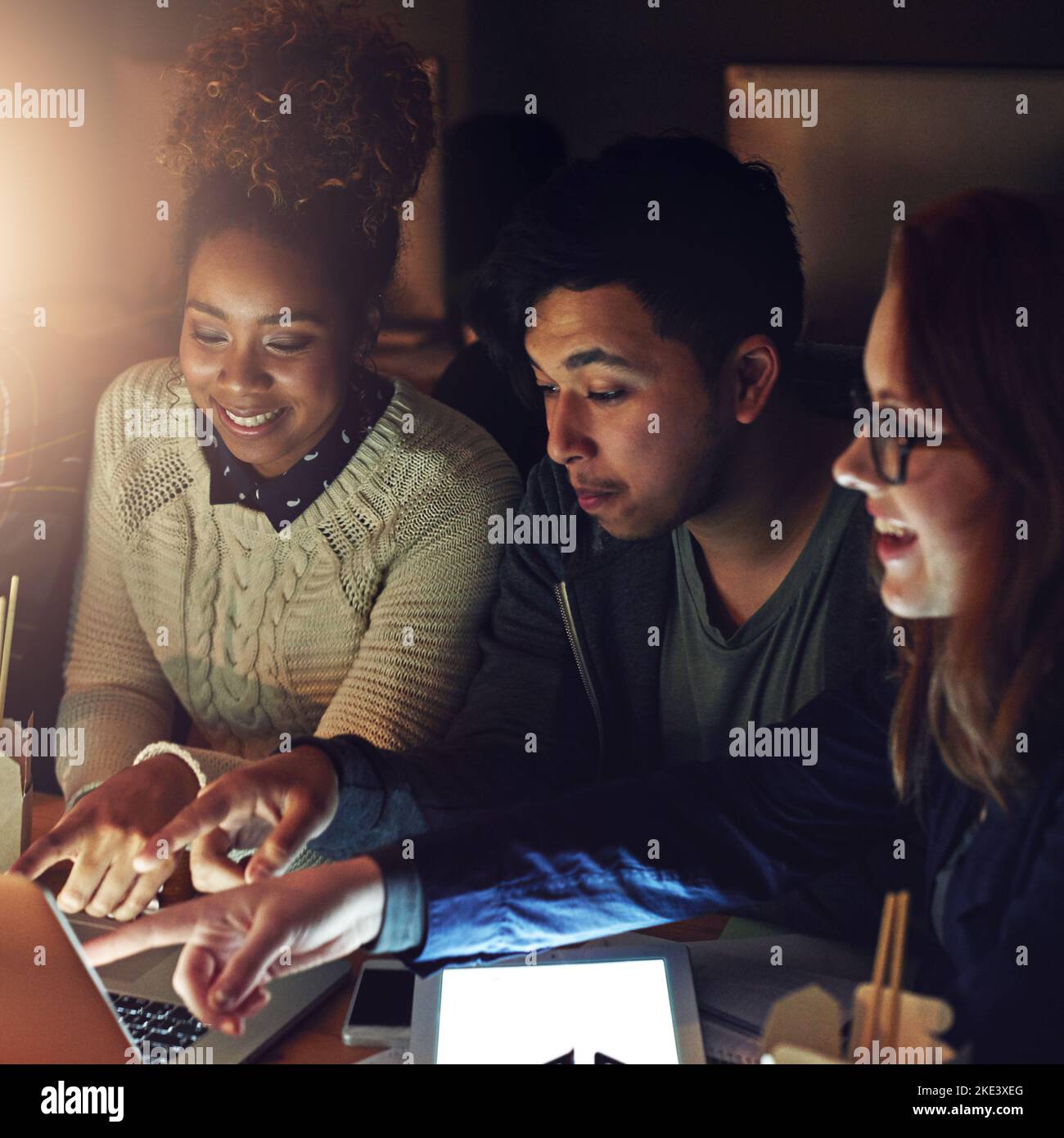 Working late today pays off tomorrow. a business team using a laptop ...