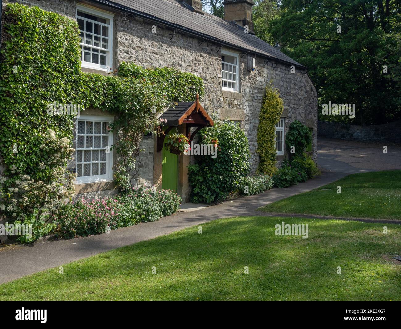 The attractive Bridge House, a stone built cottage on the green in the ...