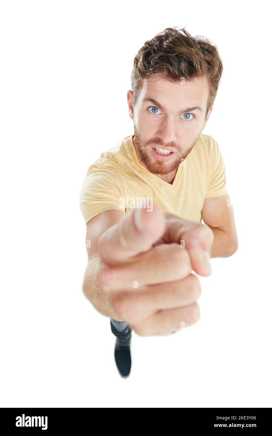 Why I oughta. Studio portrait of an angry young man pointing upwards ...