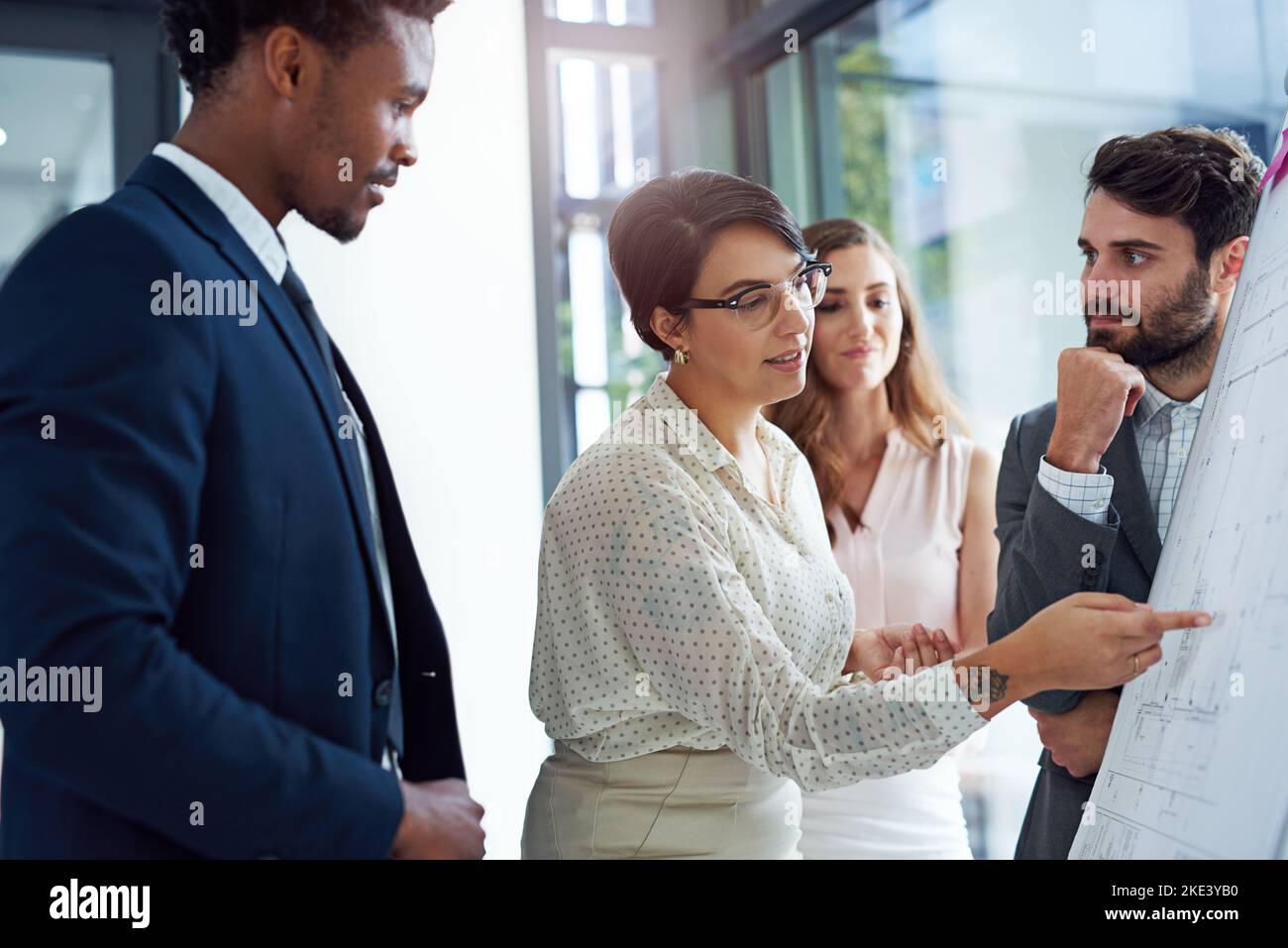 Success demands effective collaboration. a team of professionals having ...