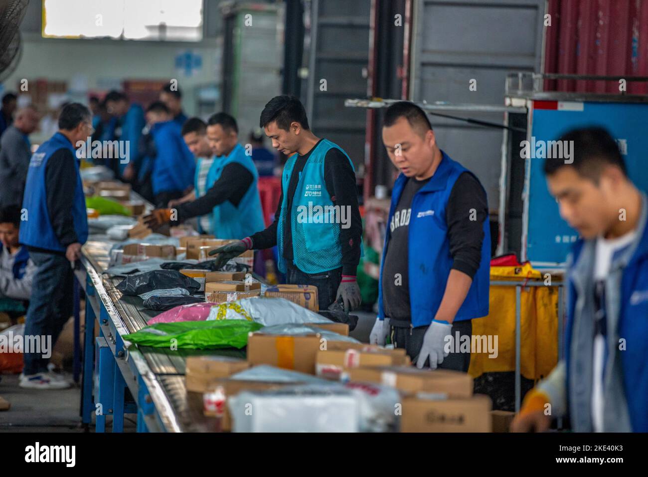 The sorting staff of the express company is working in the workshop in ...