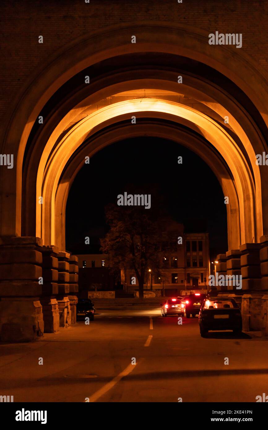 Arch in the courtyard. City building, building at night with ...
