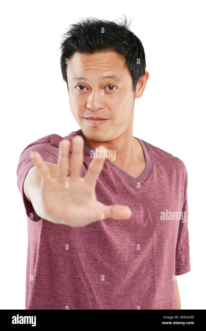 Dont take another step. Studio portrait of a young man holding out his ...