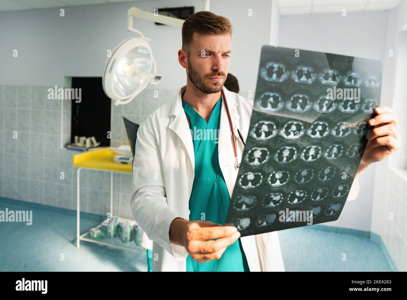 Radiologist, doctor examining x-ray images of patient for diagnosis ...