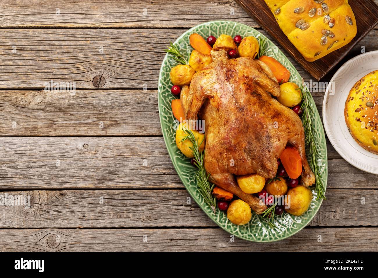 Thanksgiving turkey and pumpkin bread on rustic table with copy space ...