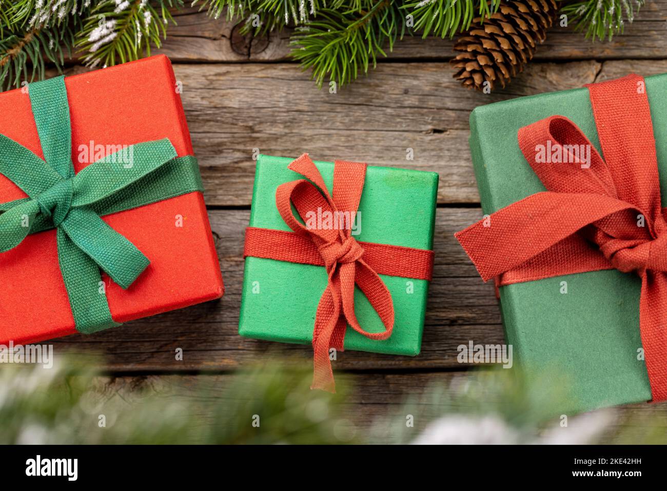 Christmas gift boxes and fir tree with snow. Flat lay Stock Photo - Alamy
