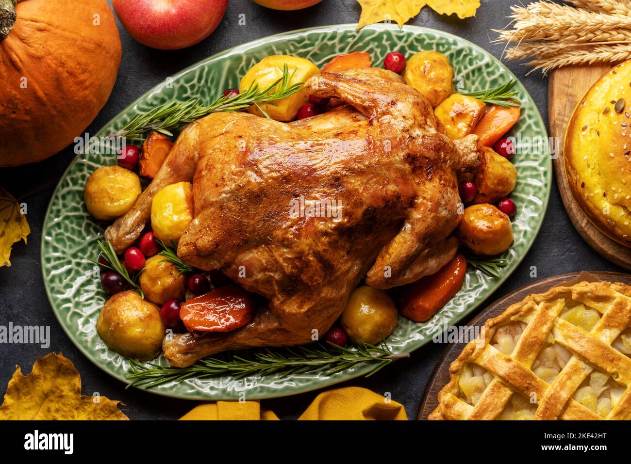 Thanksgiving turkey, apple pie and pumpkin bread on rustic table. Flat ...