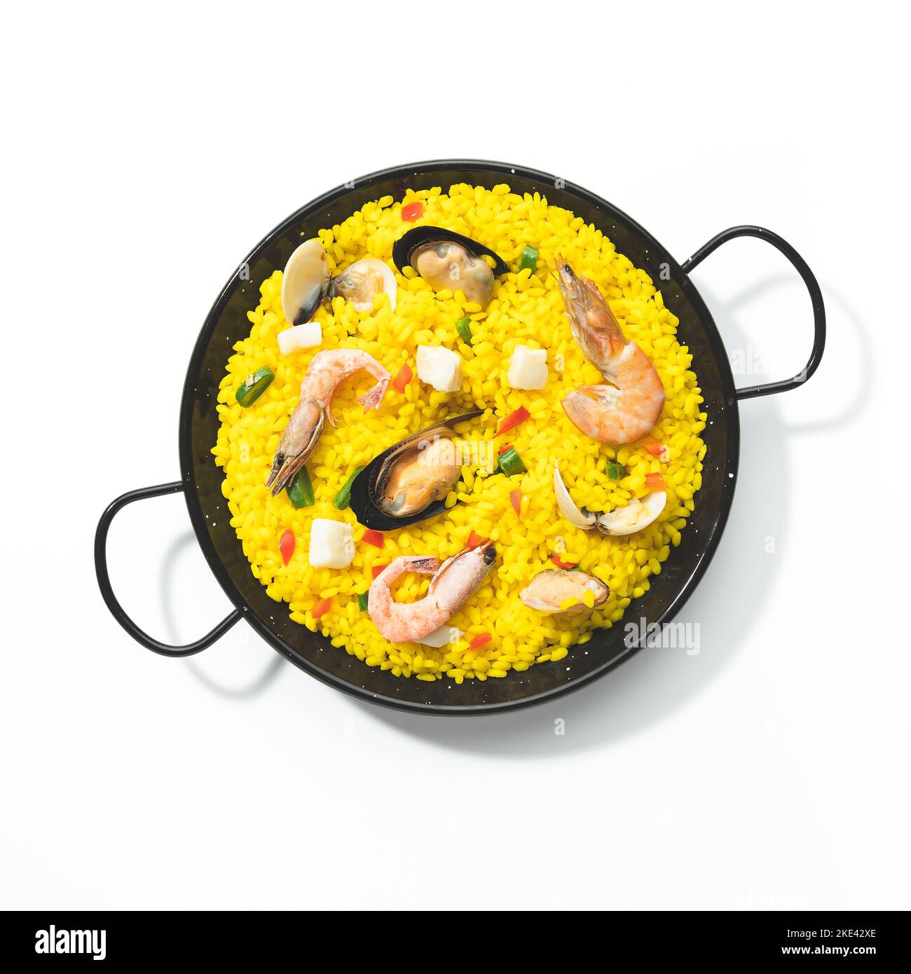 Paella isolated on white background. Top view Stock Photo - Alamy