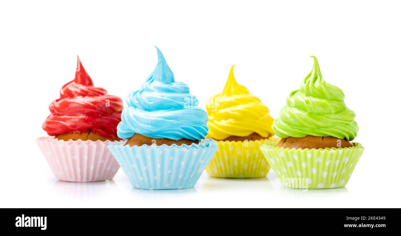 Colorful cupcakes isolated on white background Stock Photo - Alamy