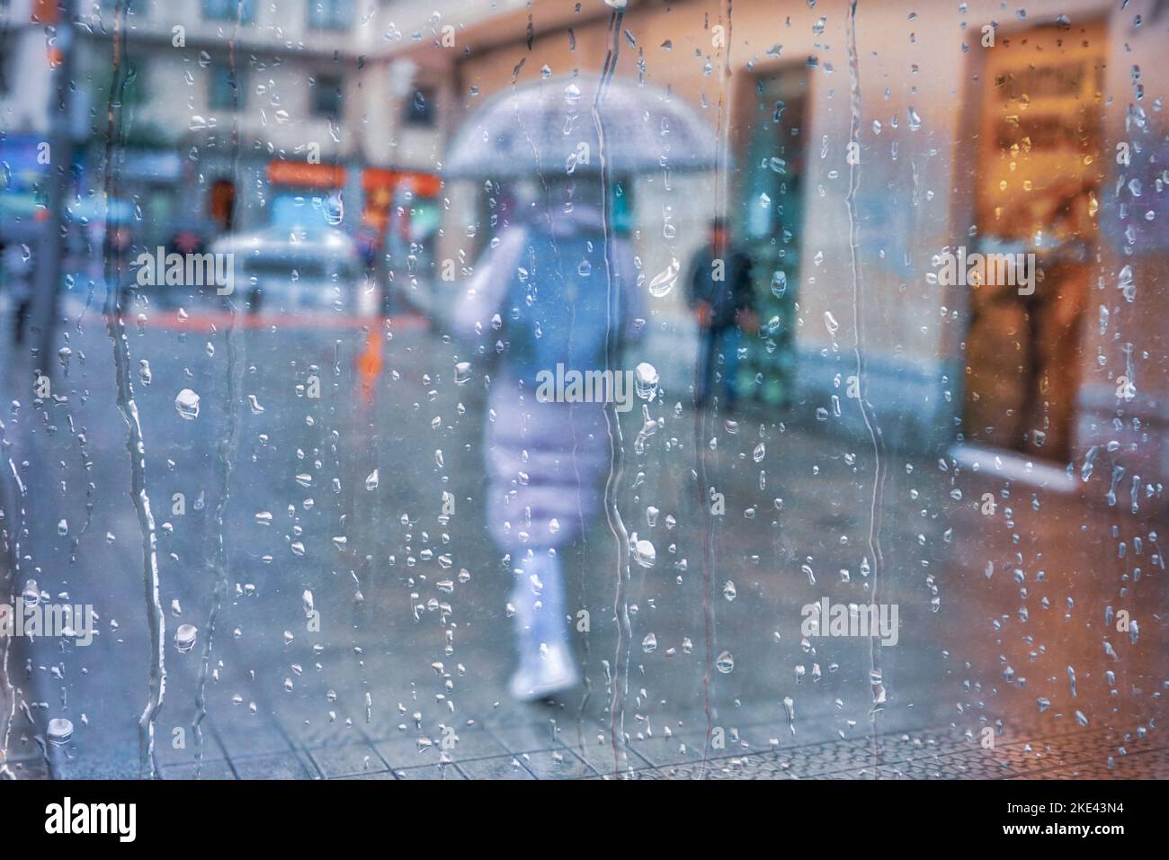 people with an umbrella in rainy days in Bilbao city, Basque country ...
