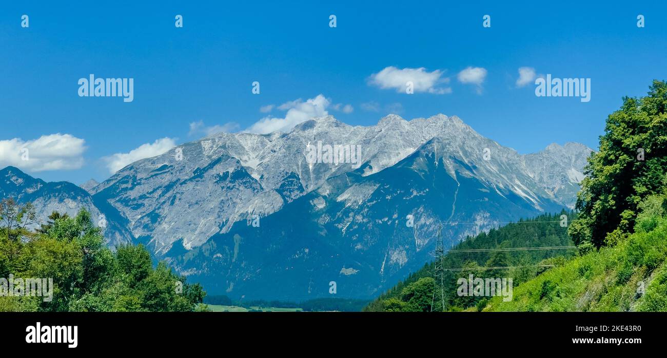 dolomite mountains in alps with clouds and fog in landscape scenery ...