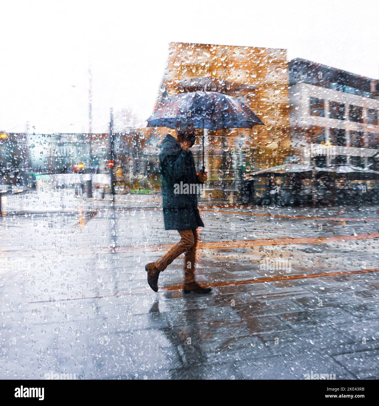 people with an umbrella in rainy days in Bilbao city, Basque country ...
