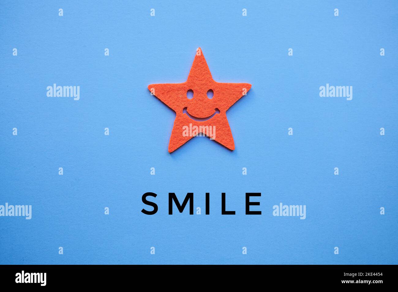 smile emotion on the blue background Stock Photo - Alamy