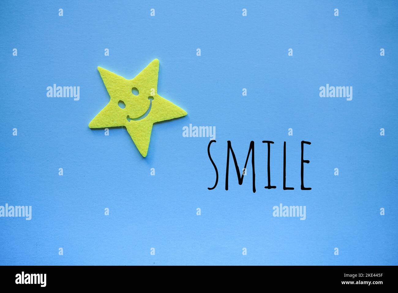 smile emotion on the blue background Stock Photo - Alamy