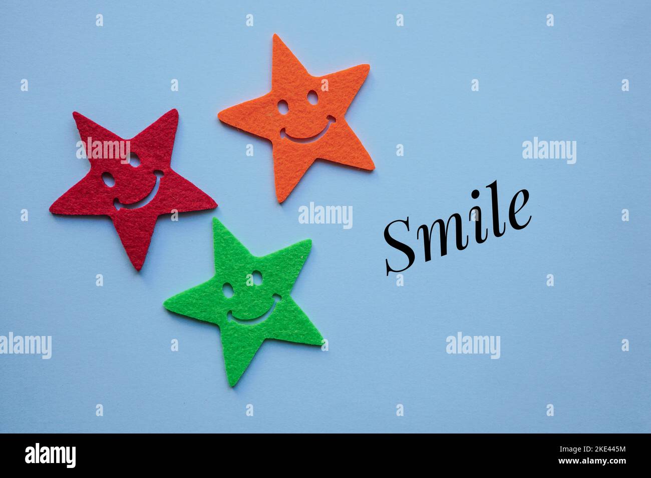 smile emotion on the blue background Stock Photo - Alamy