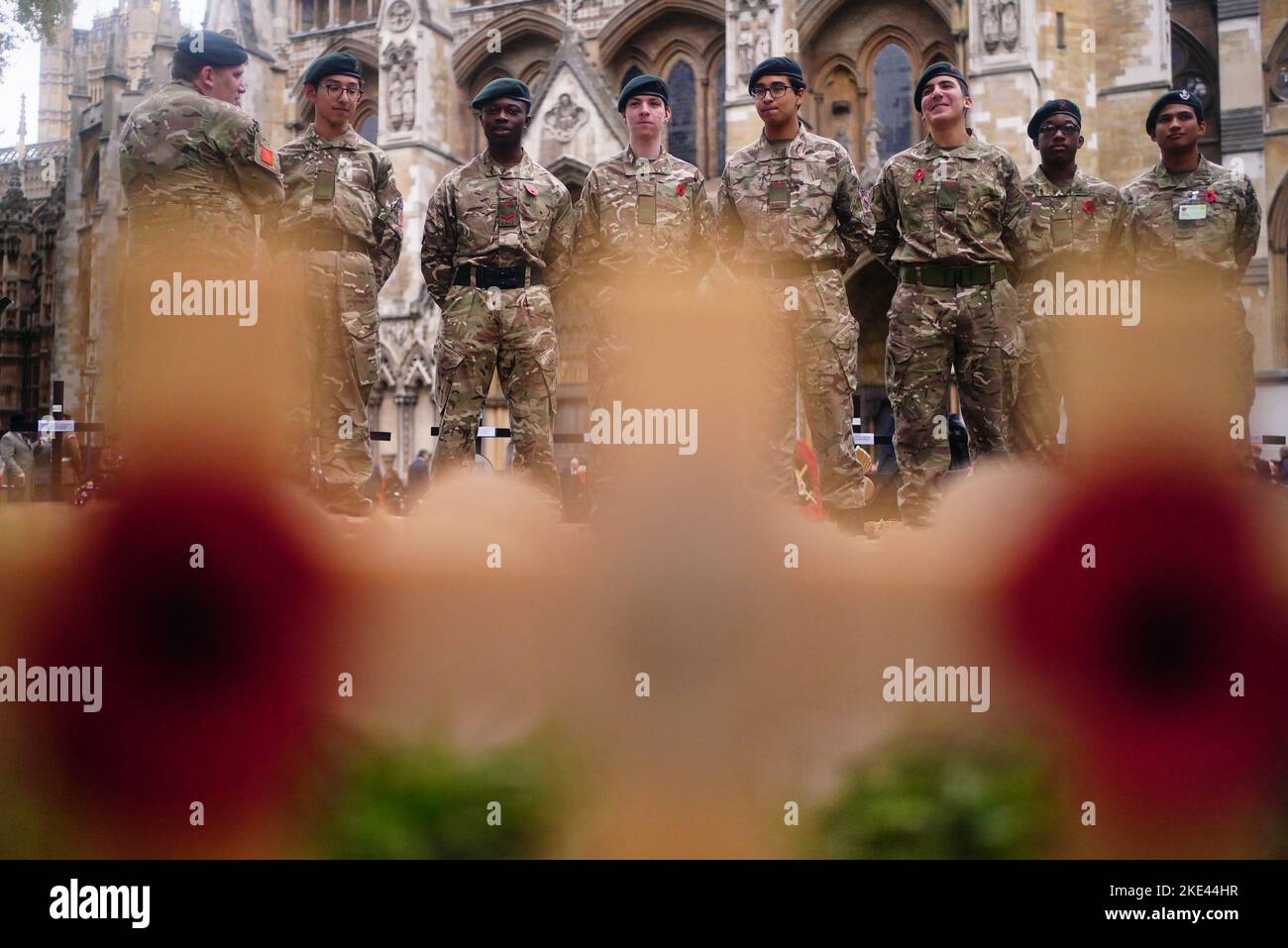 Cadets look at messages and crosses on display at the Field of ...
