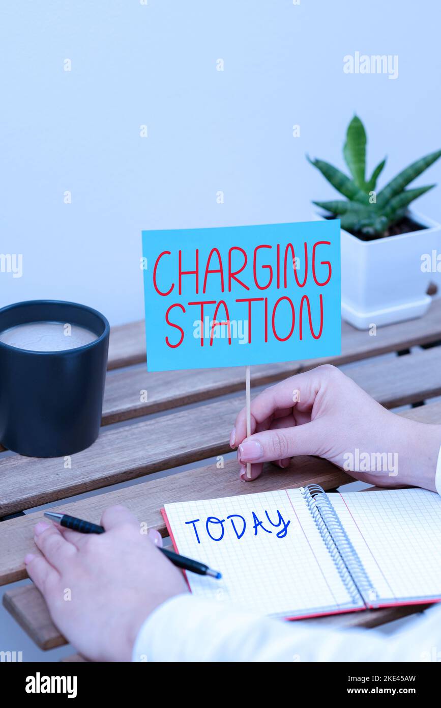 Text sign showing Charging Station. Business overview places where ...