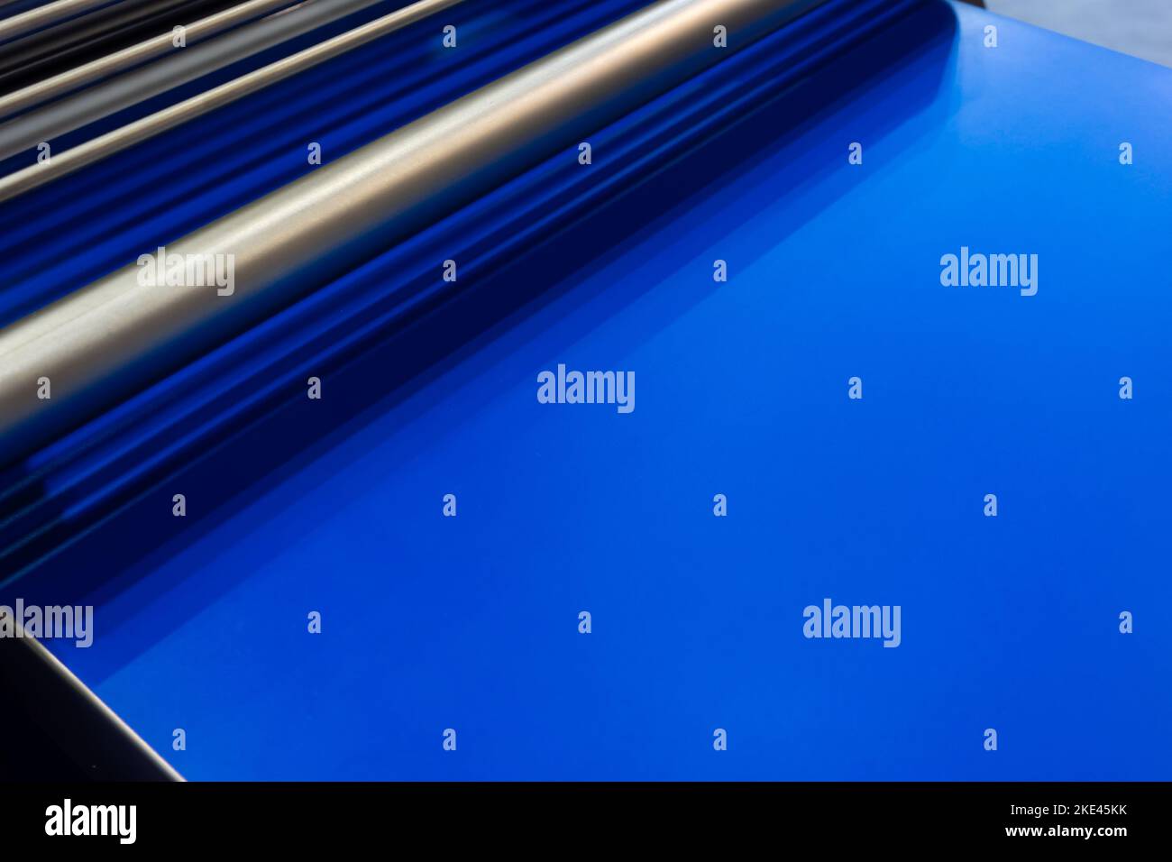 Blue polypropylene belt of an industrial infeed conveyor. The photo was ...