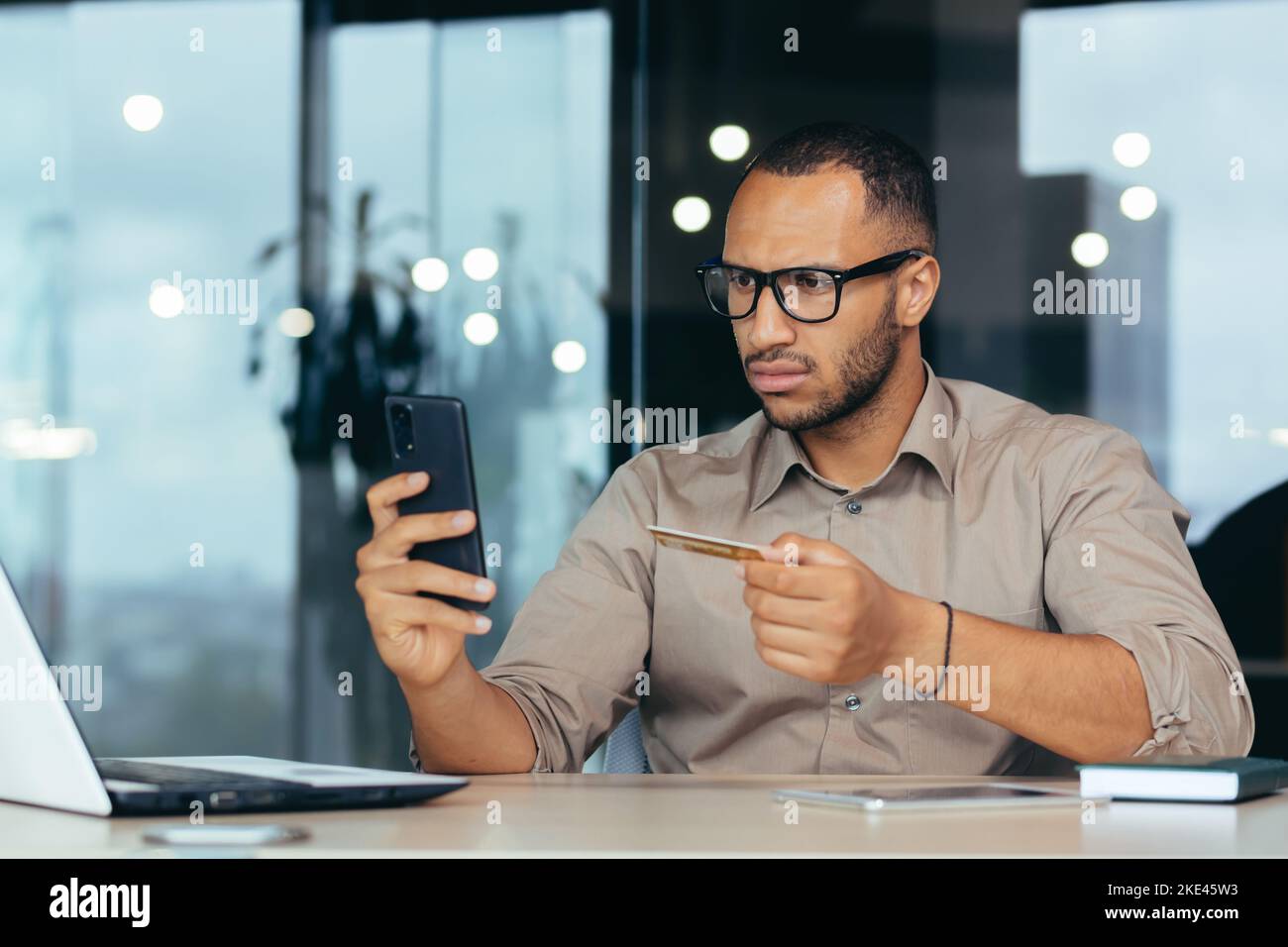 Dissatisfied and angry african american businessman inside office ...