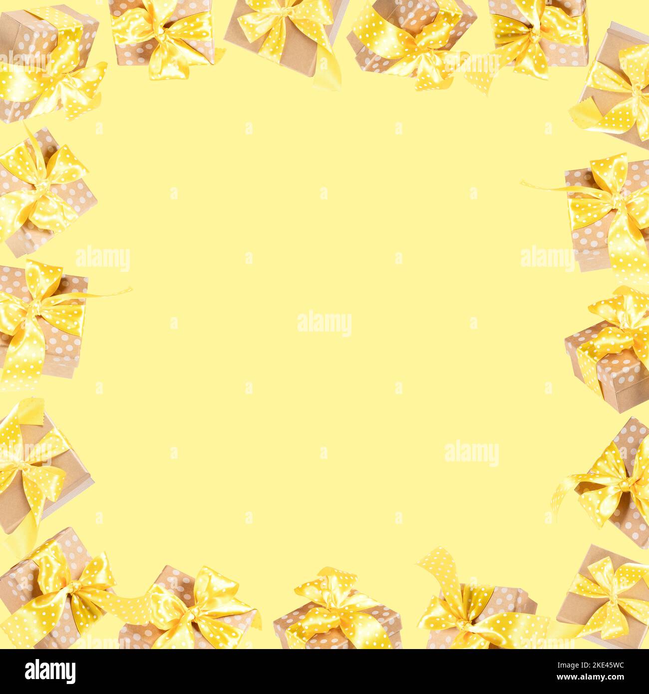Frame of lot of wrapped gift boxes from craft papers with yellow polka ...