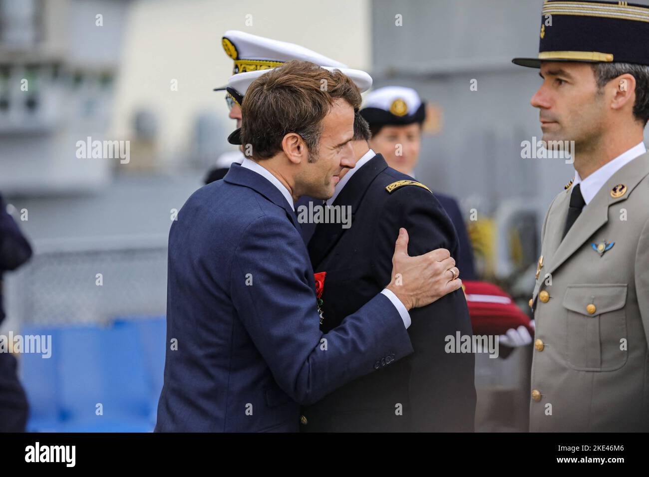 French President Emmanuel Macron decorates soldiers from the deck of ...