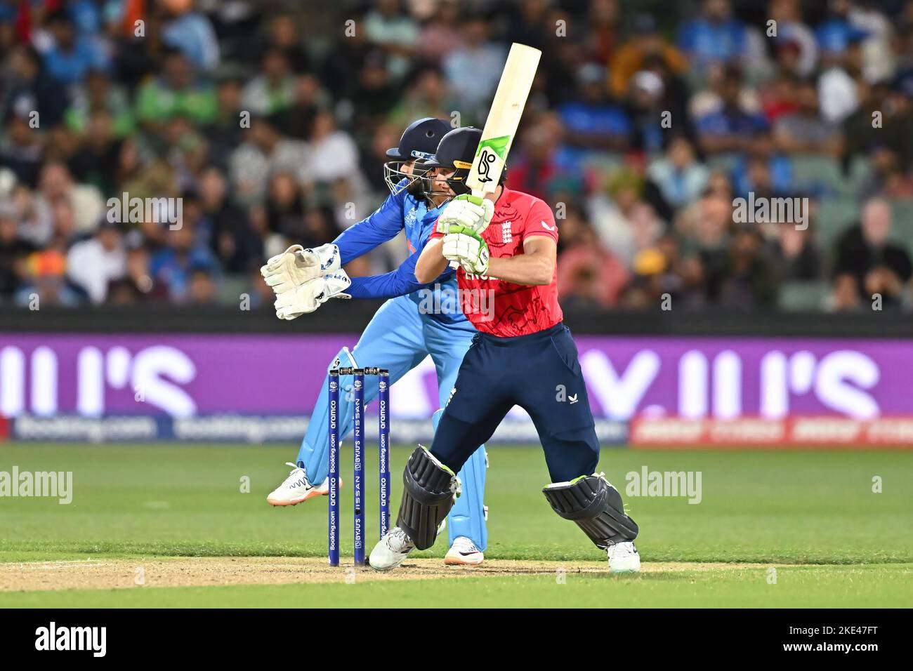 Jos Buttler (C) of England play shot between the wicket during the ICC ...