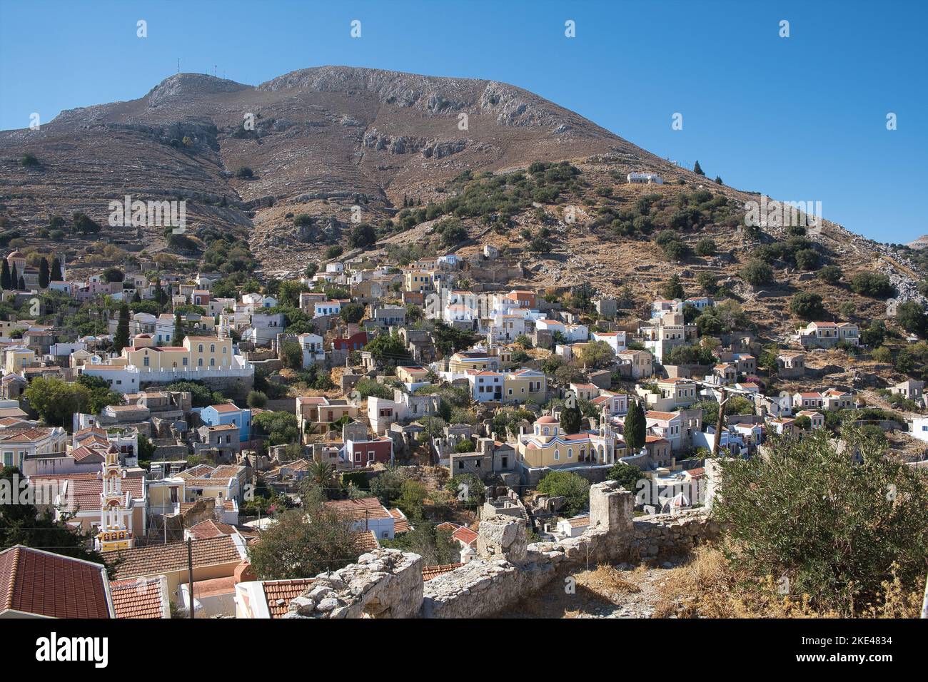 An aerial view of buildings in Symi village on Symi island, Greece ...